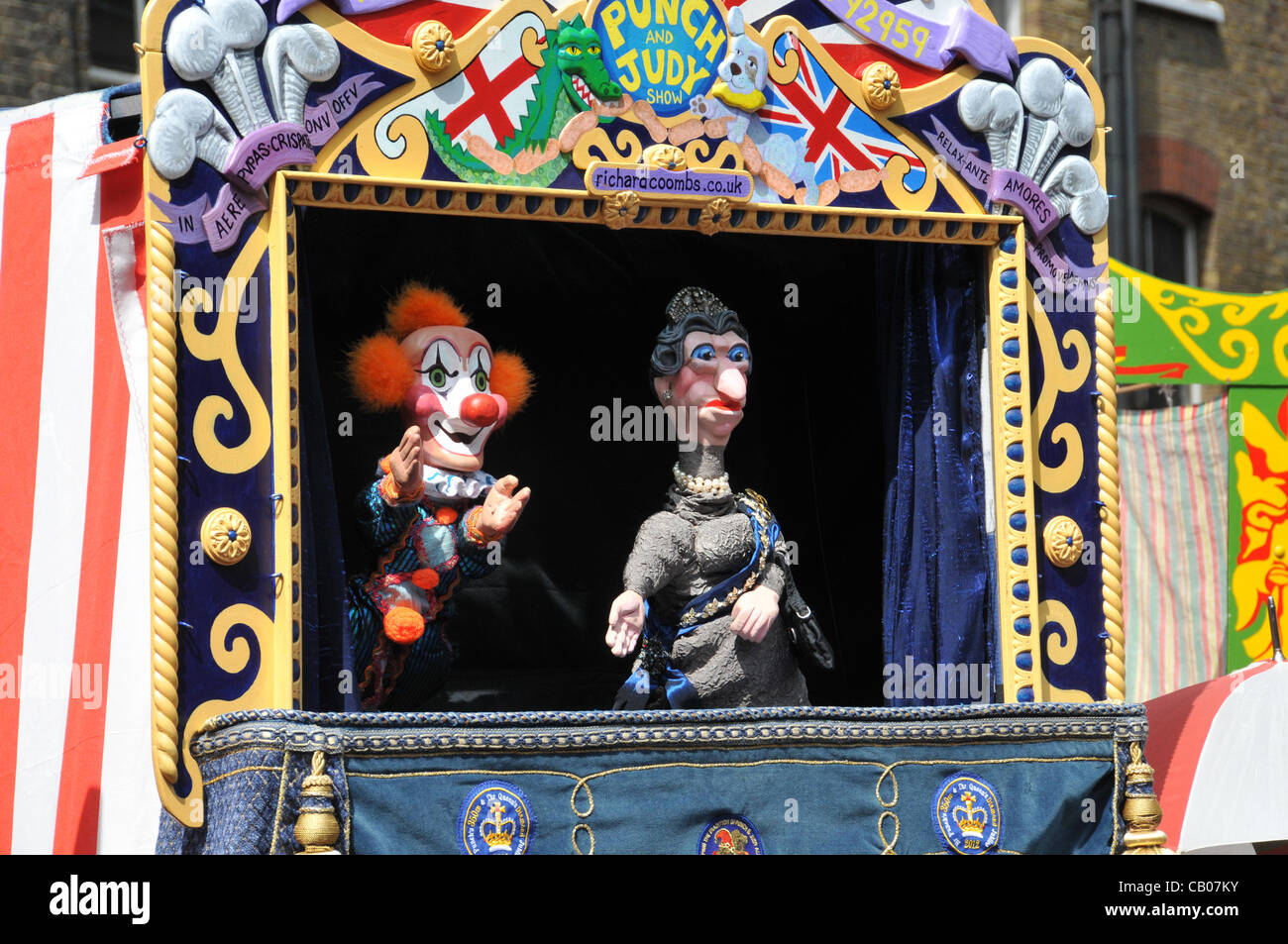Joey the Clown and a puppet of The Queen as performers of Punch and ...