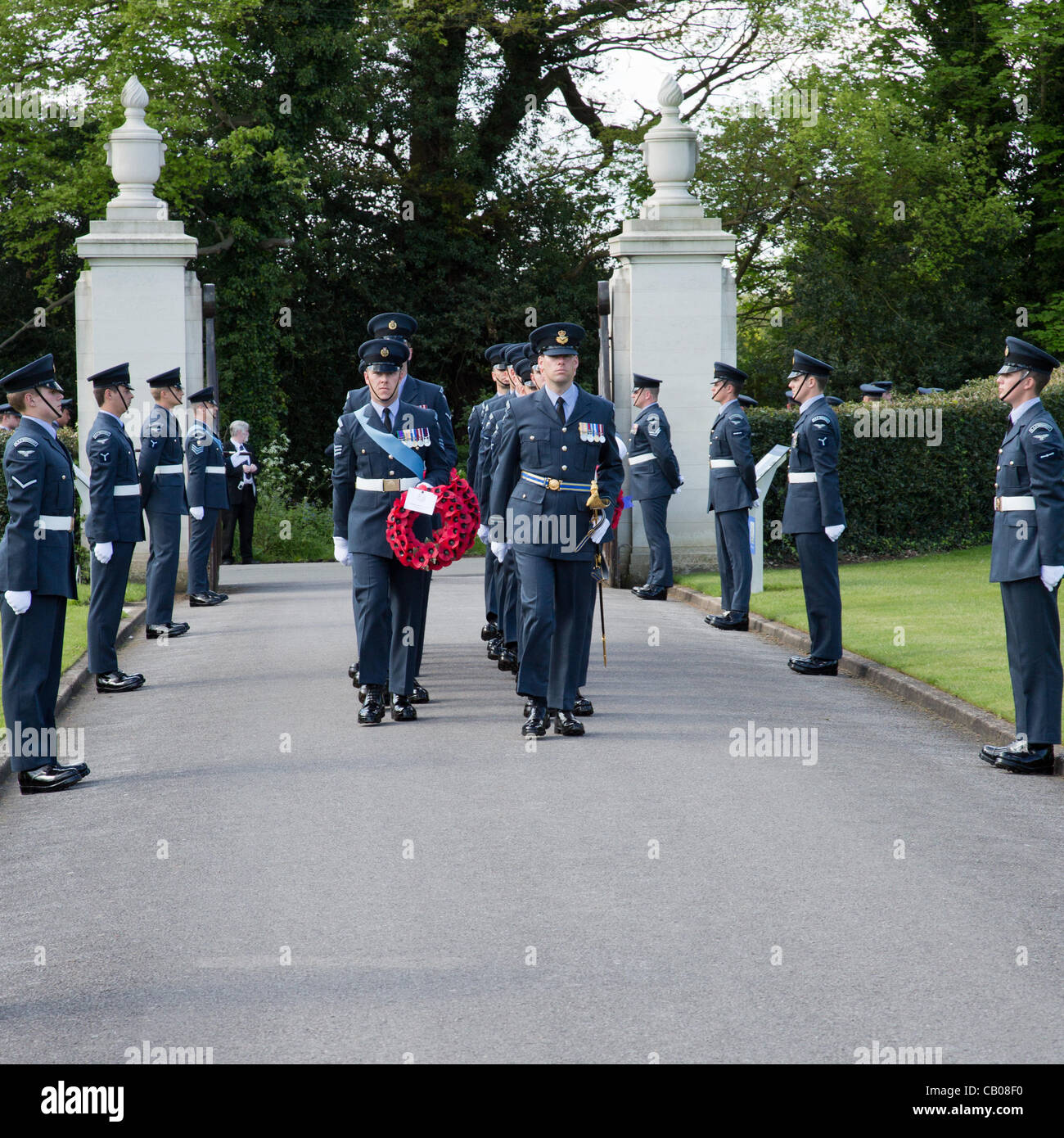 RAF Regiment wreath bearers march past an Honor Guard on their way to ...