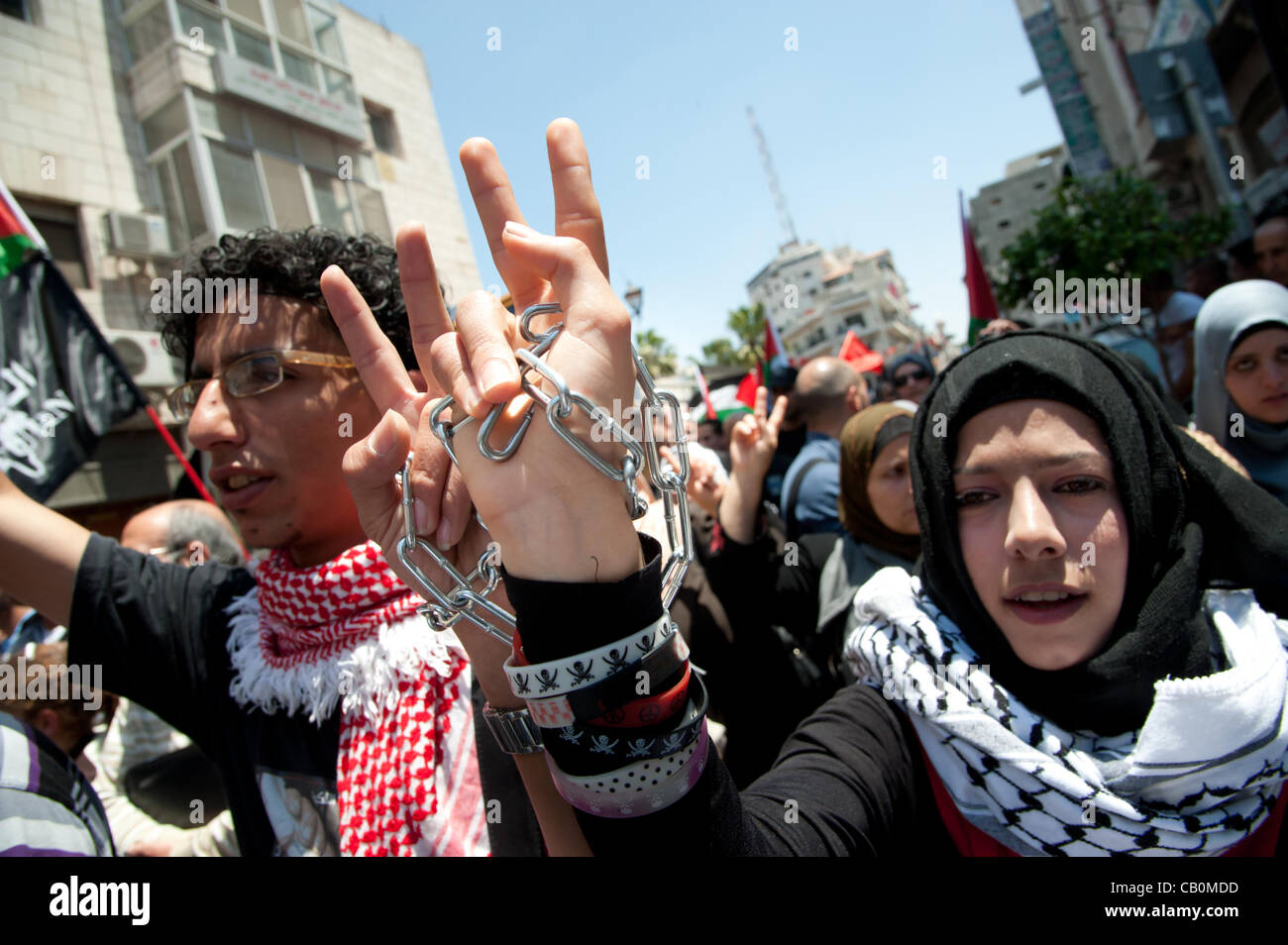 RAMALLAH, PALESTINIAN TERRITORIES - MAY 15, 2012: Palestinians marching ...