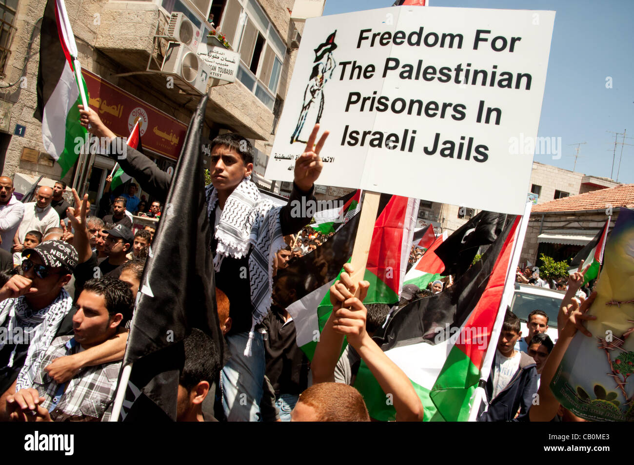 RAMALLAH, PALESTINIAN TERRITORIES - MAY 15, 2012: Flag-waving ...