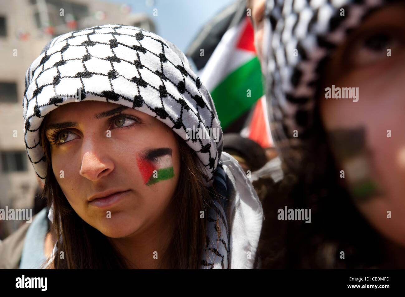 RAMALLAH, PALESTINIAN TERRITORIES - MAY 15, 2012: Wearing keffiyeh ...