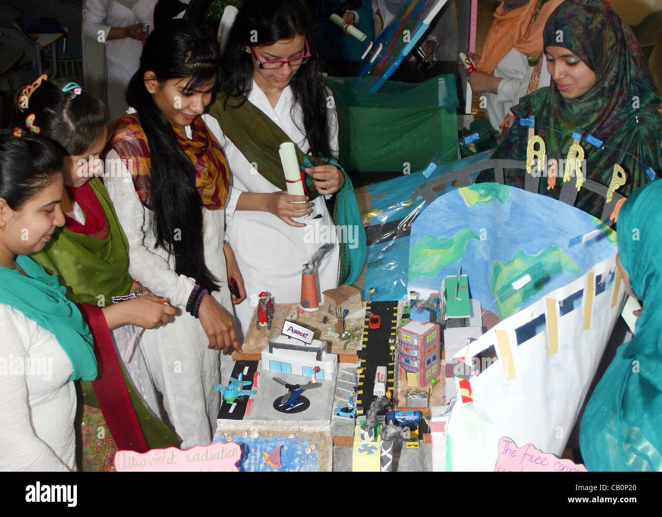 Students visit a stall during science exhibition arranged by Jinnah ...