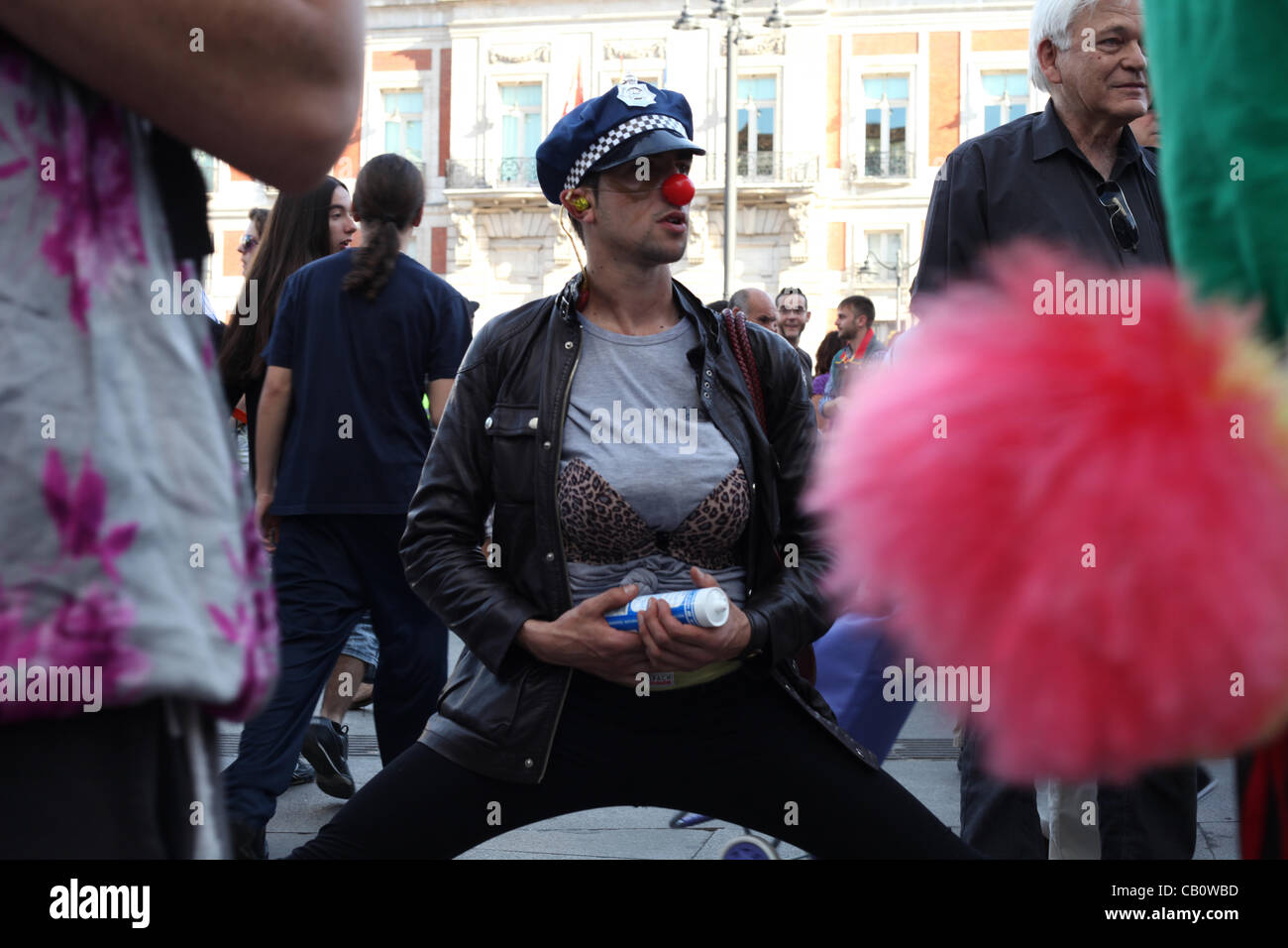 Madrid, Spain. A protester in costume stands in a comedic way while ...
