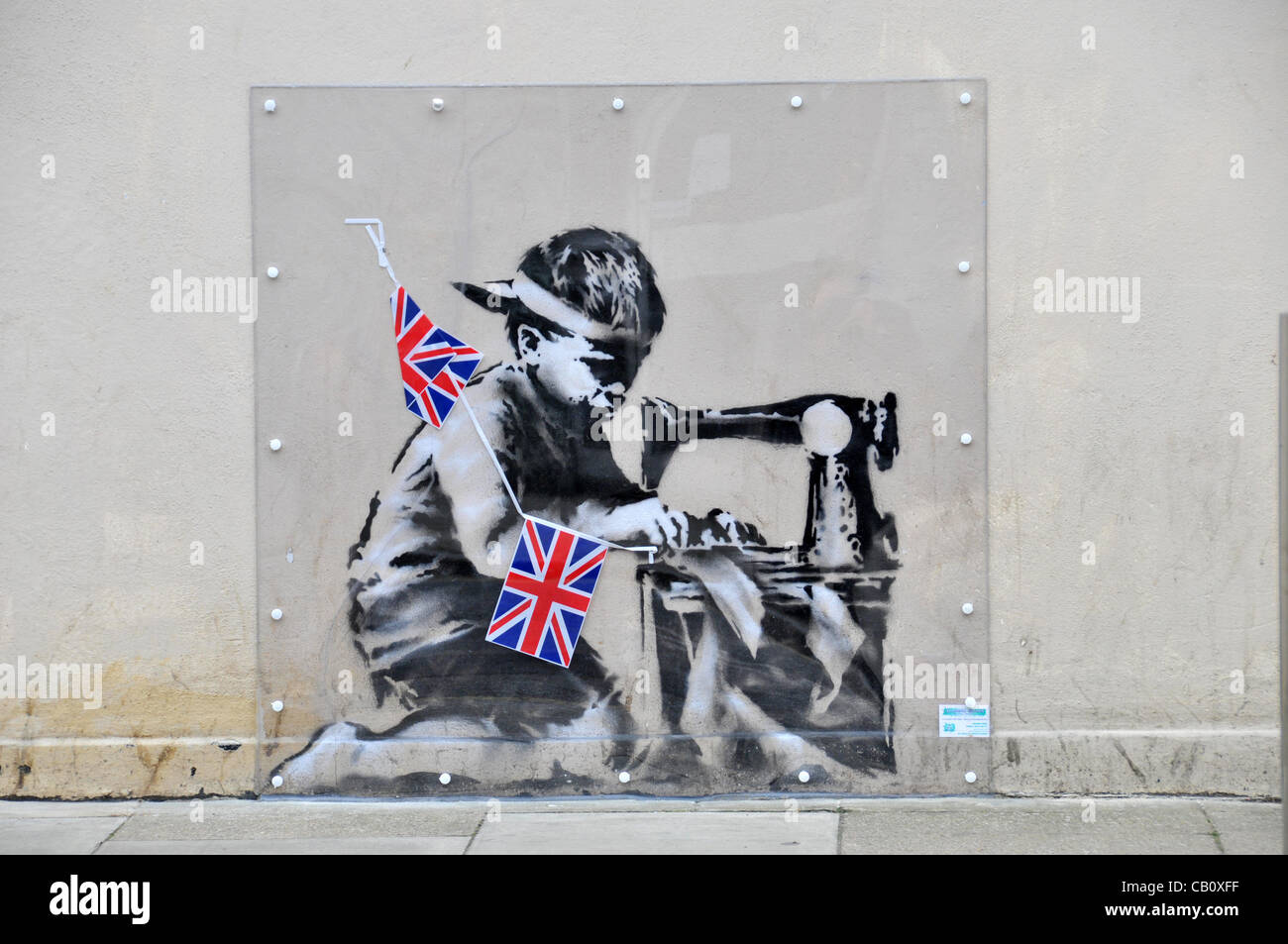 The new graffiti artwork by 'Banksy' showing a boy with a sowing ...