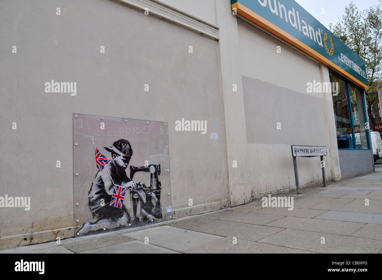 The new graffiti artwork by 'Banksy' showing a boy with a sowing ...
