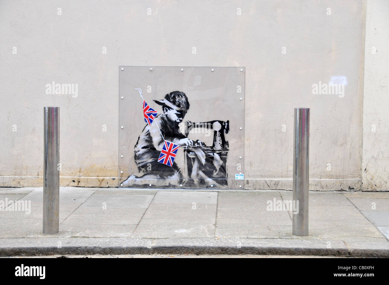 The new graffiti artwork by 'Banksy' showing a boy with a sowing ...