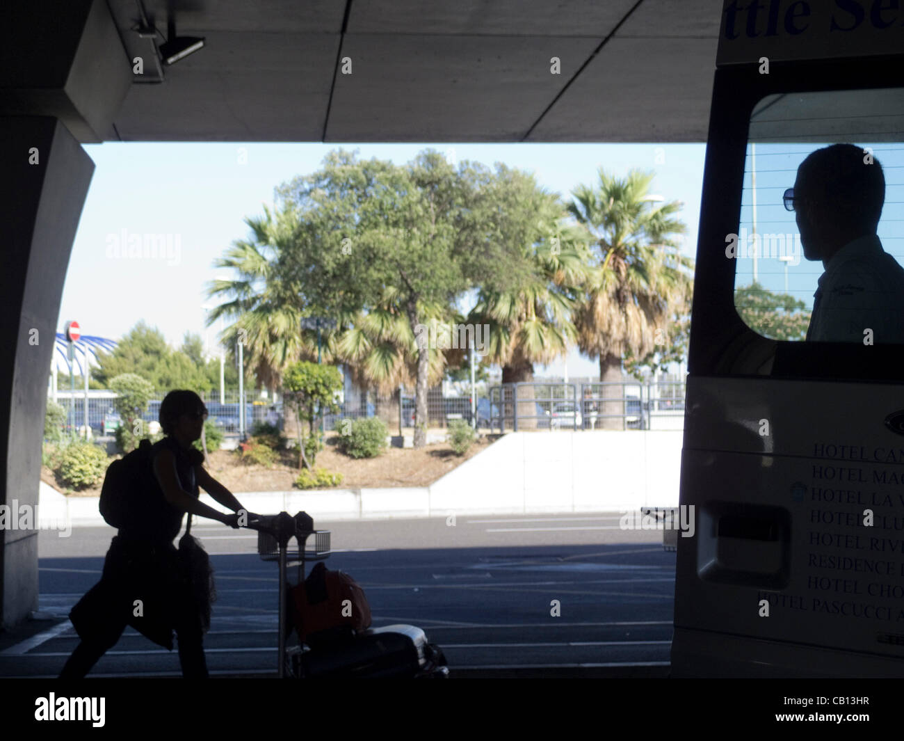 Airport shuttle bus driver at airport in Rome, Italy Stock Photo - Alamy