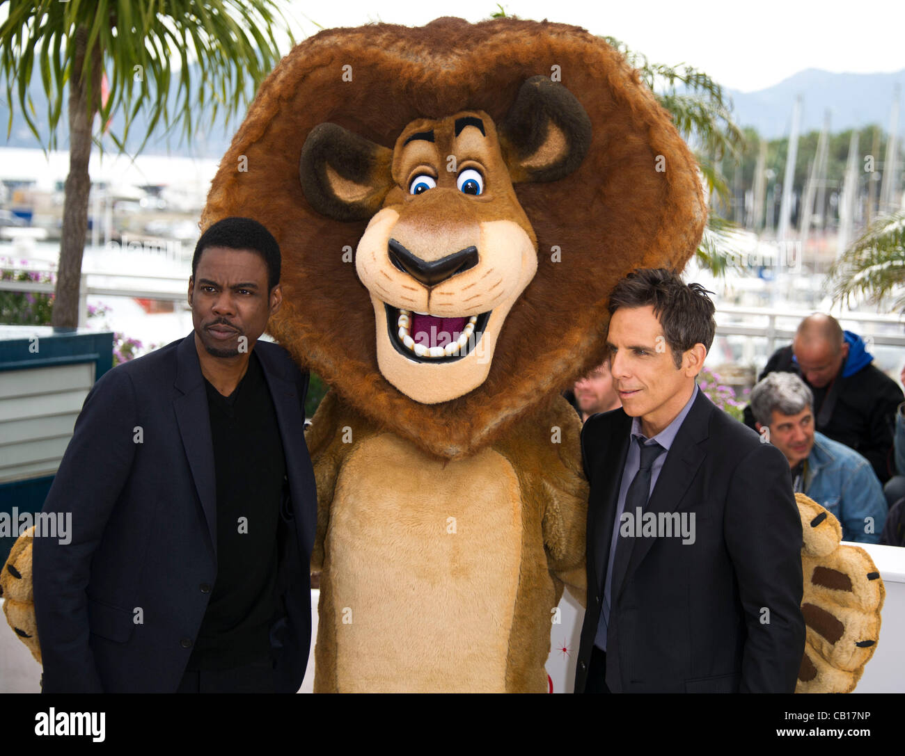 L-R: Chris Rock (actor), man dressed as character 'Alex', Ben Stiller ...