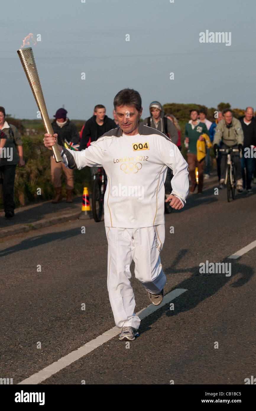 Falmouth, UK. 19 May, 2012. Steve Brady runs with the Olympic Torch at ...