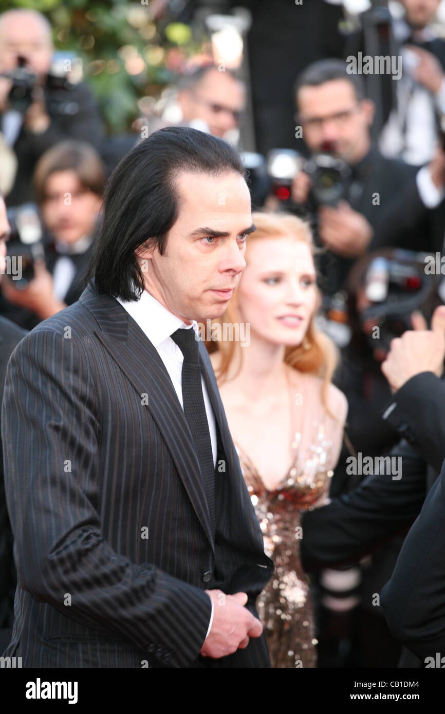 Nick Cave and Jessica Chastain attend the gala screening of Lawless at ...