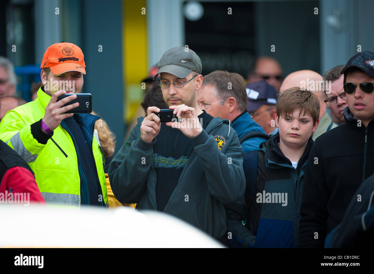 Nissan GT-R is surrounded by fans during pre-race activities ahead of ...