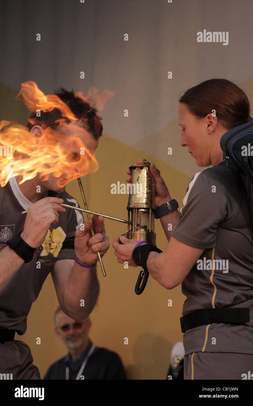 Returning the Olympic Flame to a Davey Lamp after the Olympic Torch ...