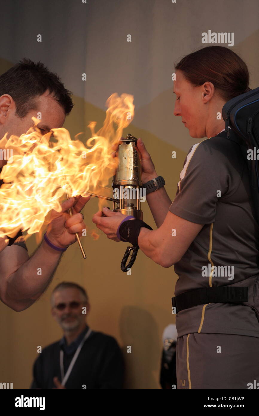 Returning the Olympic Flame to a Davey Lamp after the Olympic Torch ...