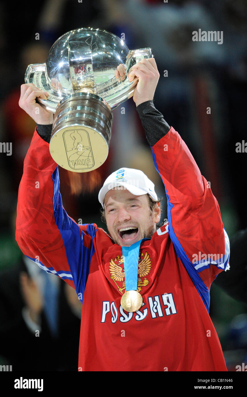 Russia's captain Ilya Nikulin holds the trophy in celebration as world champions after the gold ...