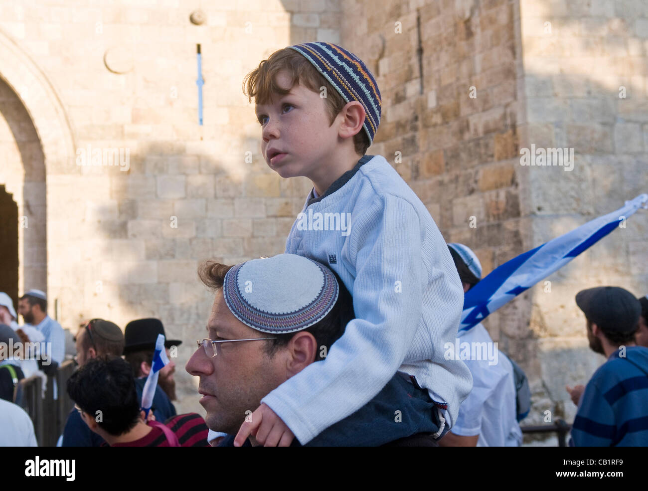 JERUSALEM - MAY 20 2012 : Right wing Israeli boy with his father on ...