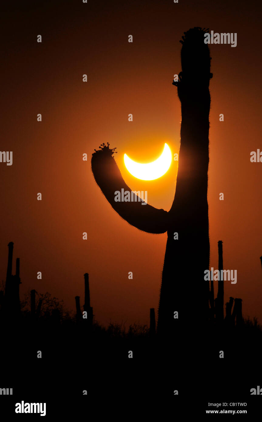 An annular solar eclipse in progress is seen from Ironwood Forest ...