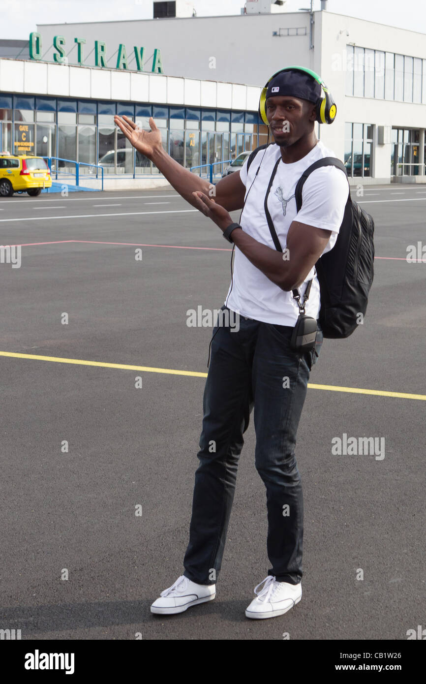 Jamaican sprinter Usain Bolt gestures at the airport after arriving in ...