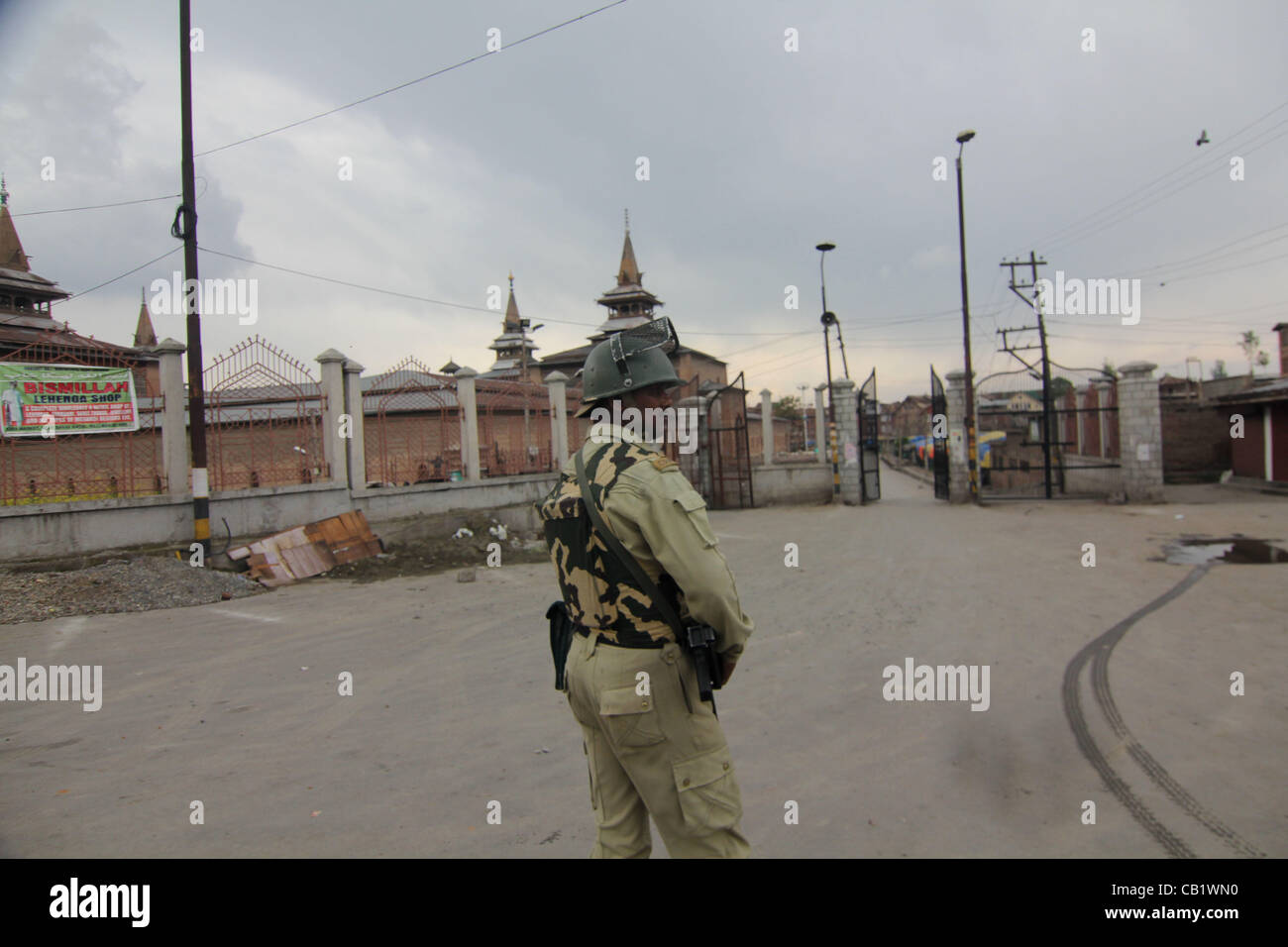 An Indian paramilitary soldier stands guard during restrictions at old ...