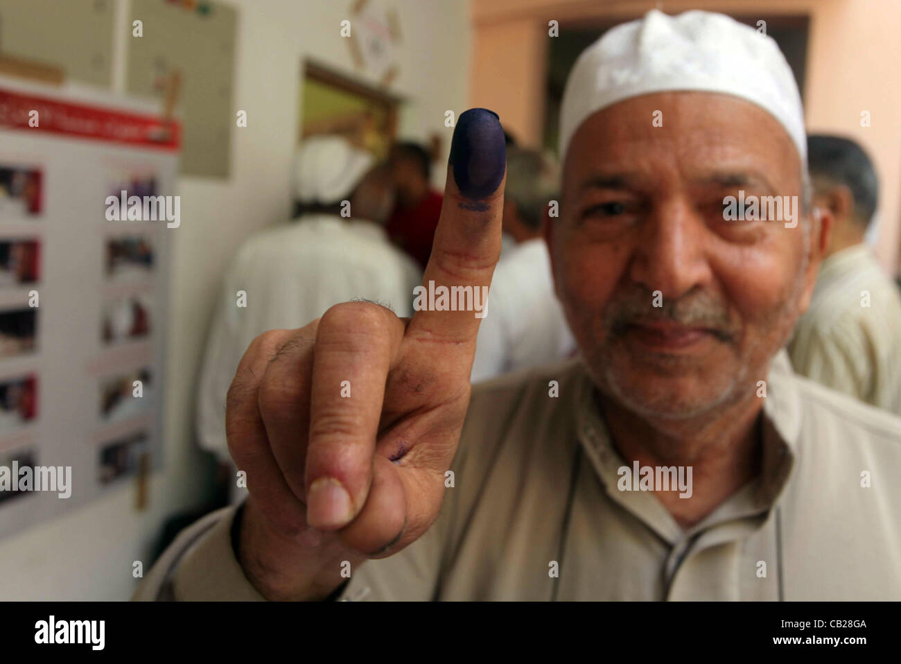 May 22, 2012 - Cairo, Cairo, Egypt - Egyptian man shows his ink-marked ...