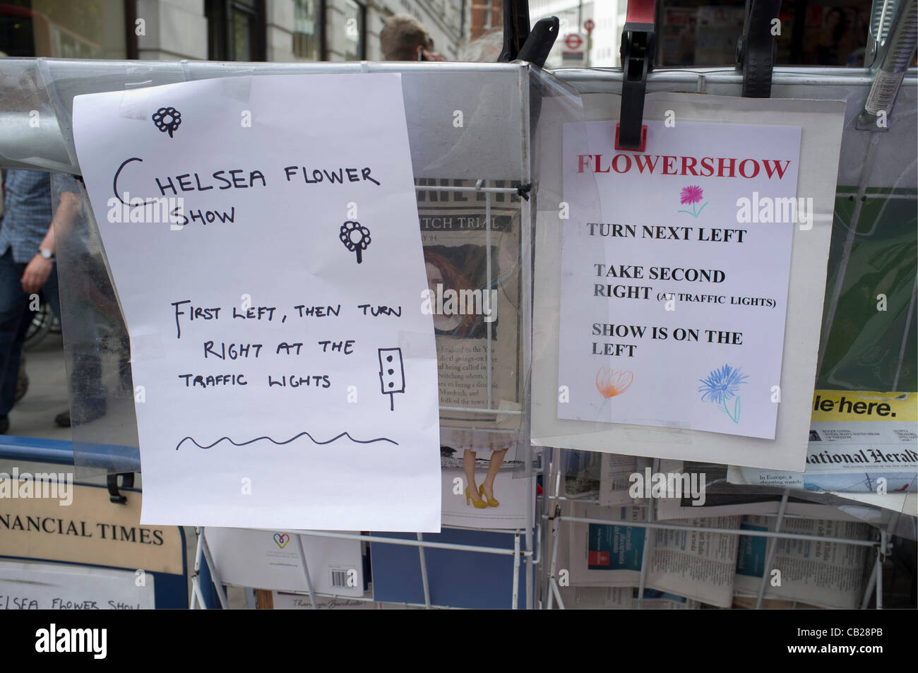 23 May, 2012. London, UK. Newsstand sign giving directions to follow to ...