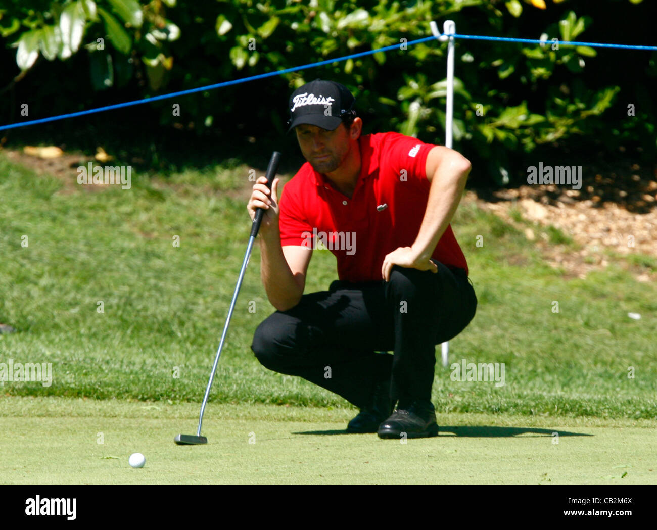 25.05.12 Virginia Water, ENGLAND: Gregory Bourdy of France lines up his putt on the 17th green ...