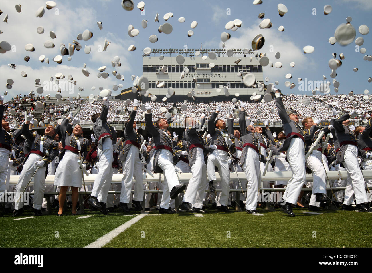 US Army Cadets toss their hats at the end of graduation ceremonies for ...