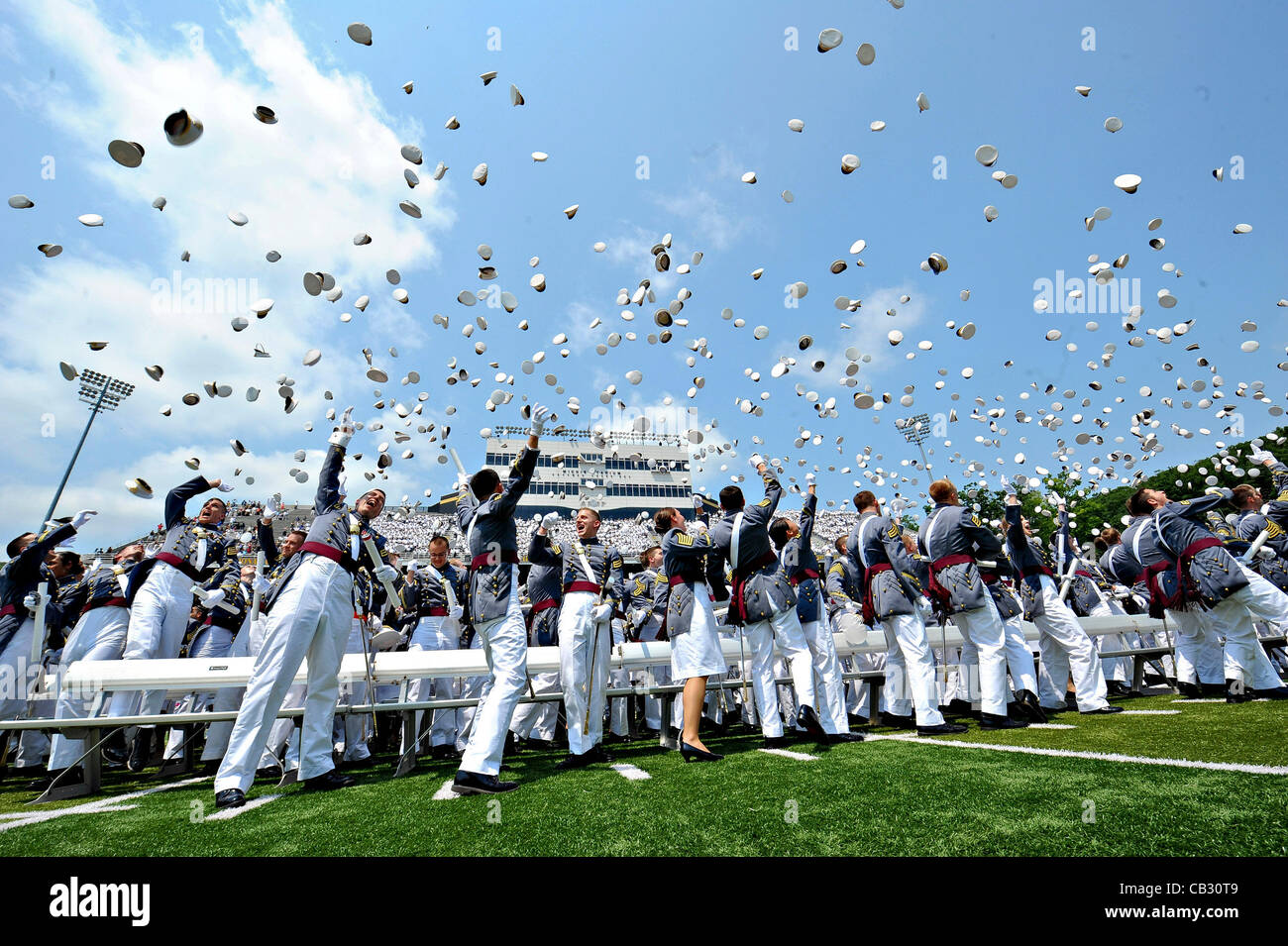 US Army Cadets toss their hats at the end of graduation ceremonies for ...