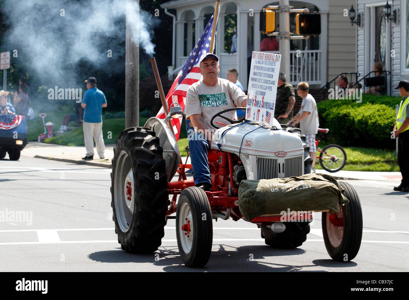 Man driving 1948 Ford tractor in Memorial Day Parade Stock Photo - Alamy