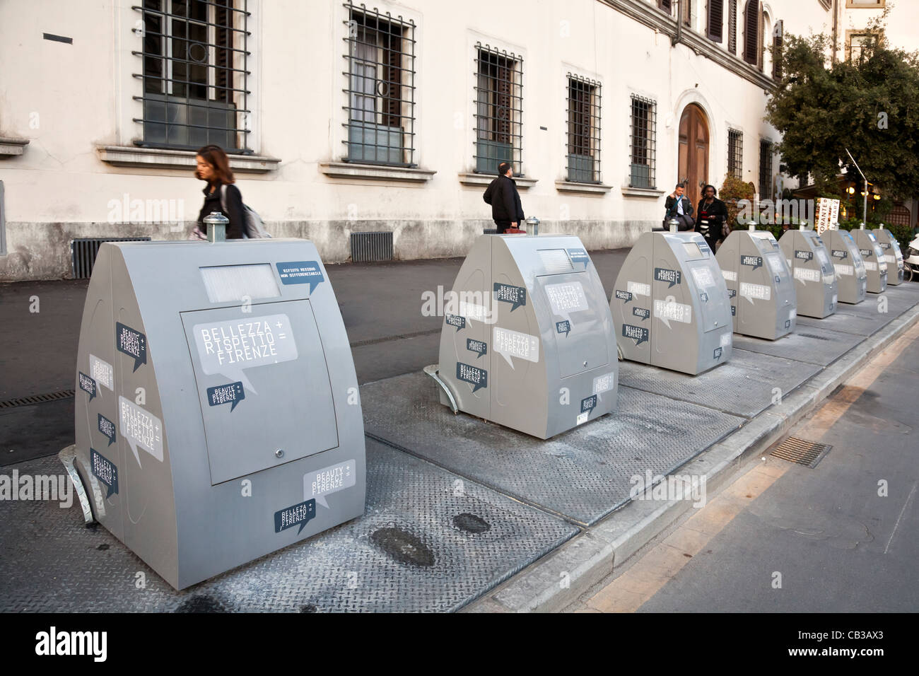A row of recycling bins for glass, cans, tetrapaks and plastic in ...