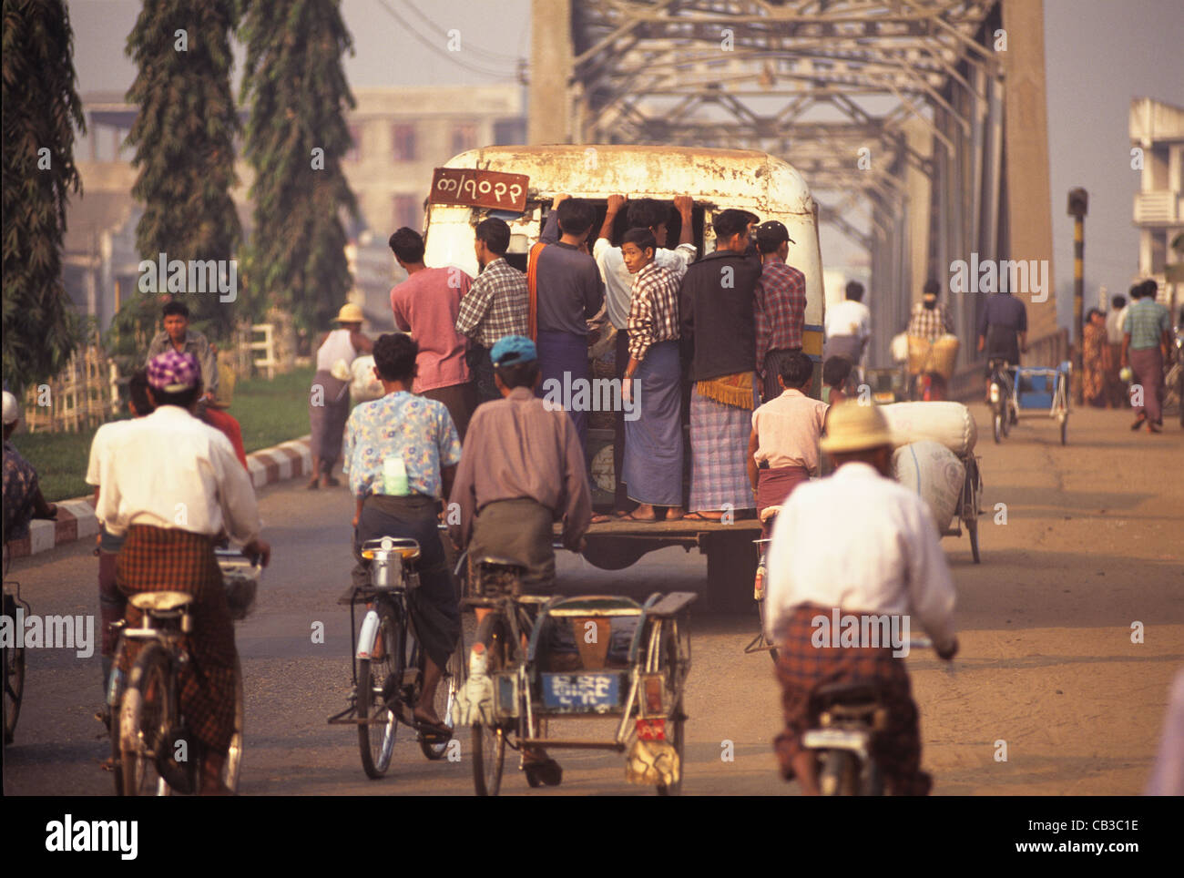 Bago(pegu) city scene, city transport, bus, bike, people crossing ...