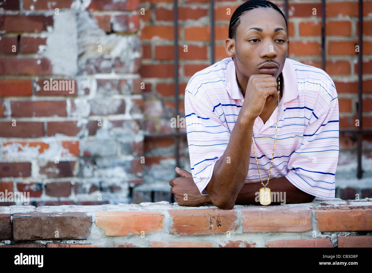 Young men hanging out in back alley Stock Photo - Alamy