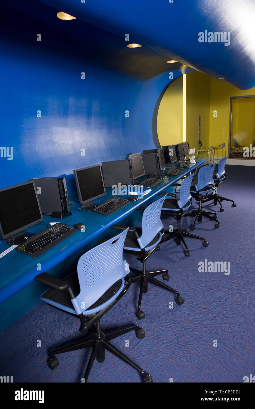 A row of chairs and computer workstations in a vacant classroom Stock ...