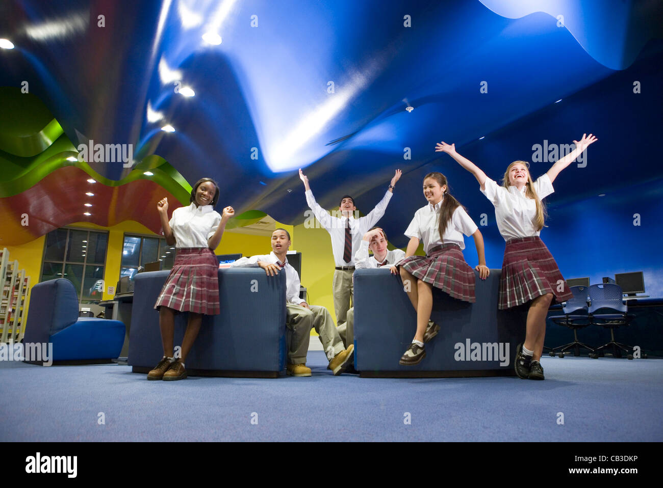 Students cheering in classroom hi-res stock photography and images - Alamy