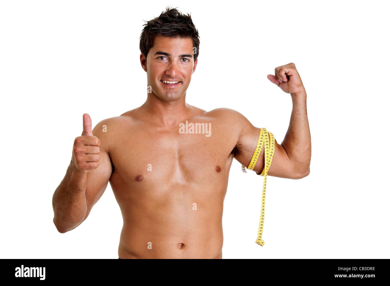 Muscular young man with measuring tape Stock Photo - Alamy