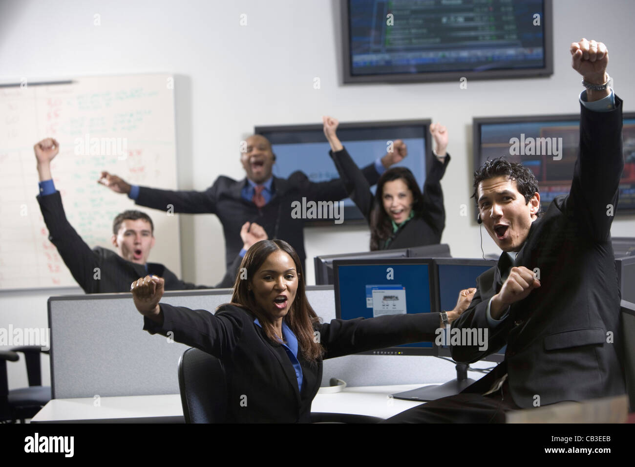 Business people cheering in an office Stock Photo - Alamy