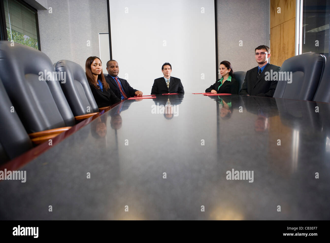 Business executives sitting together in a formal conference room Stock ...