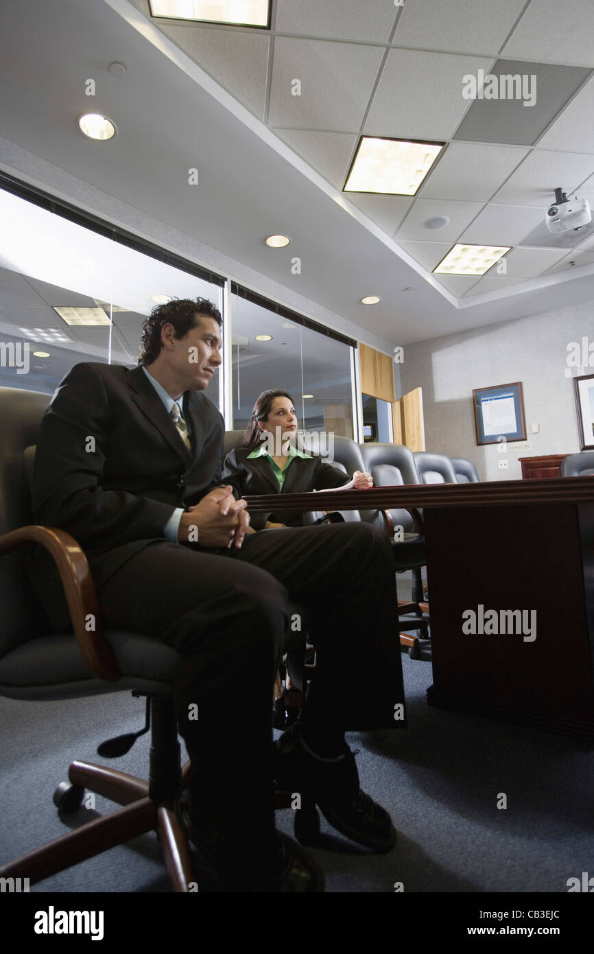Low angle view of business man and woman meeting in a formal conference ...