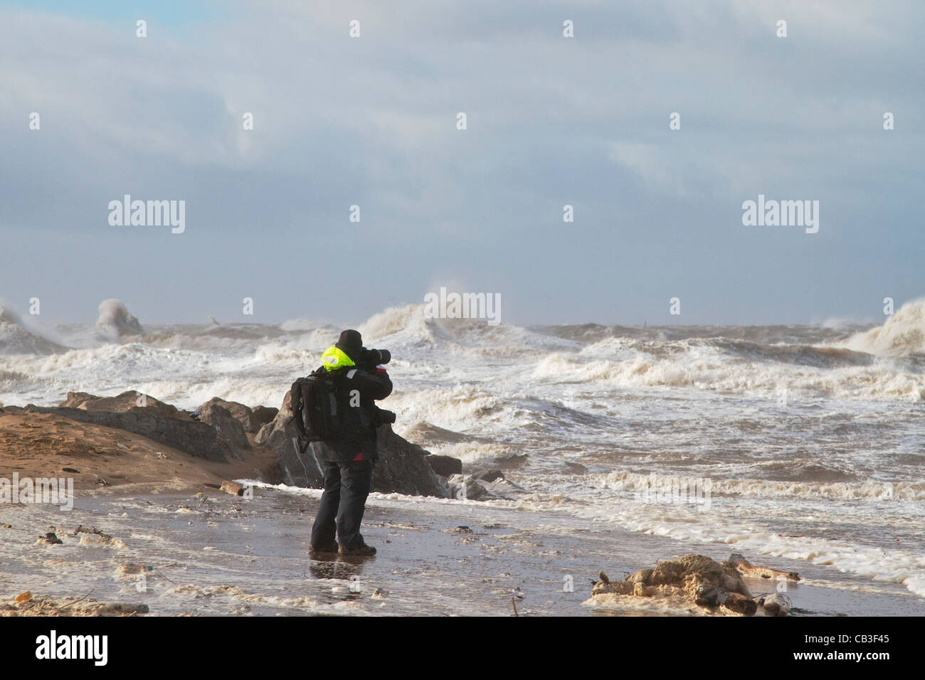 Photographer at New Brighton,during high tide with high winds ...