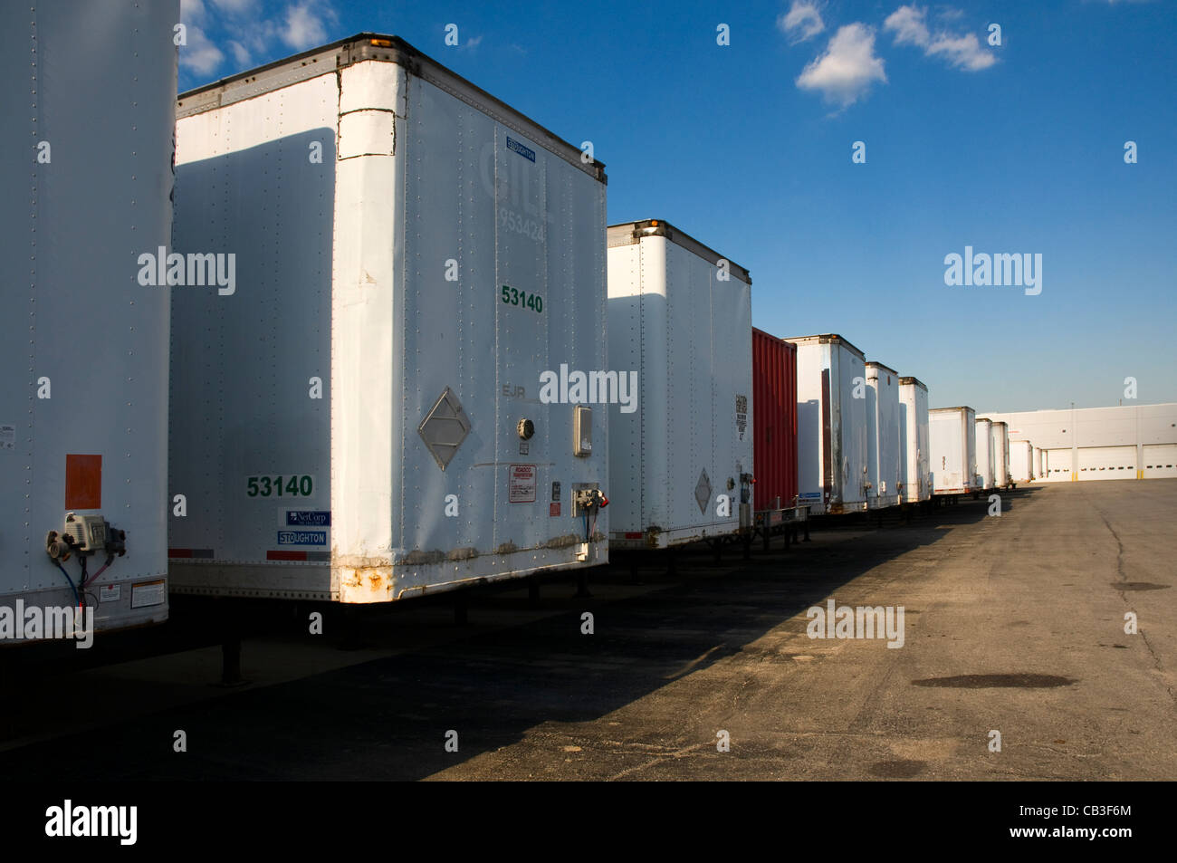 A line of trailers ready for transportation by truck in Chicago Stock ...
