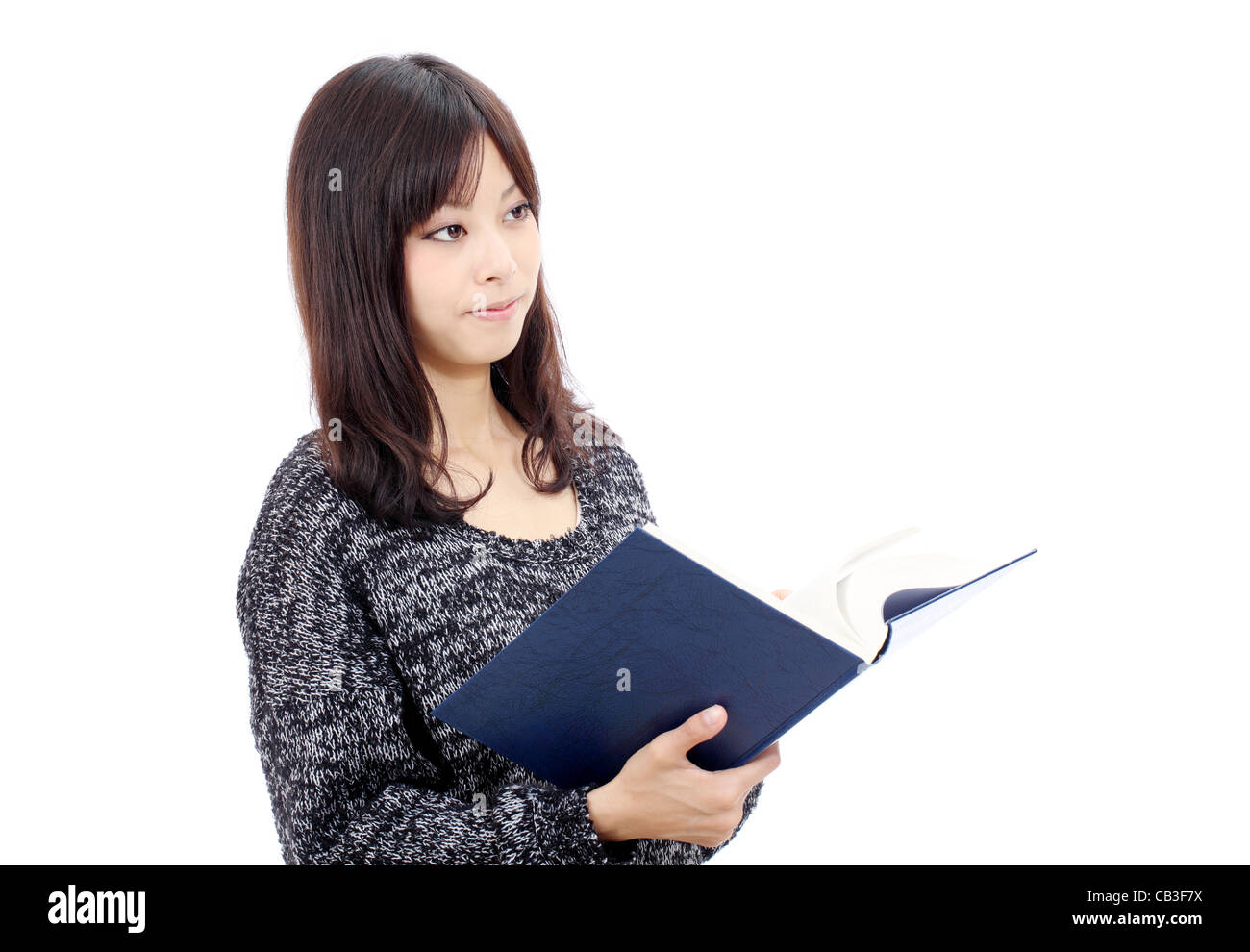 Portrait of young asian woman reading book, isolated on white ...