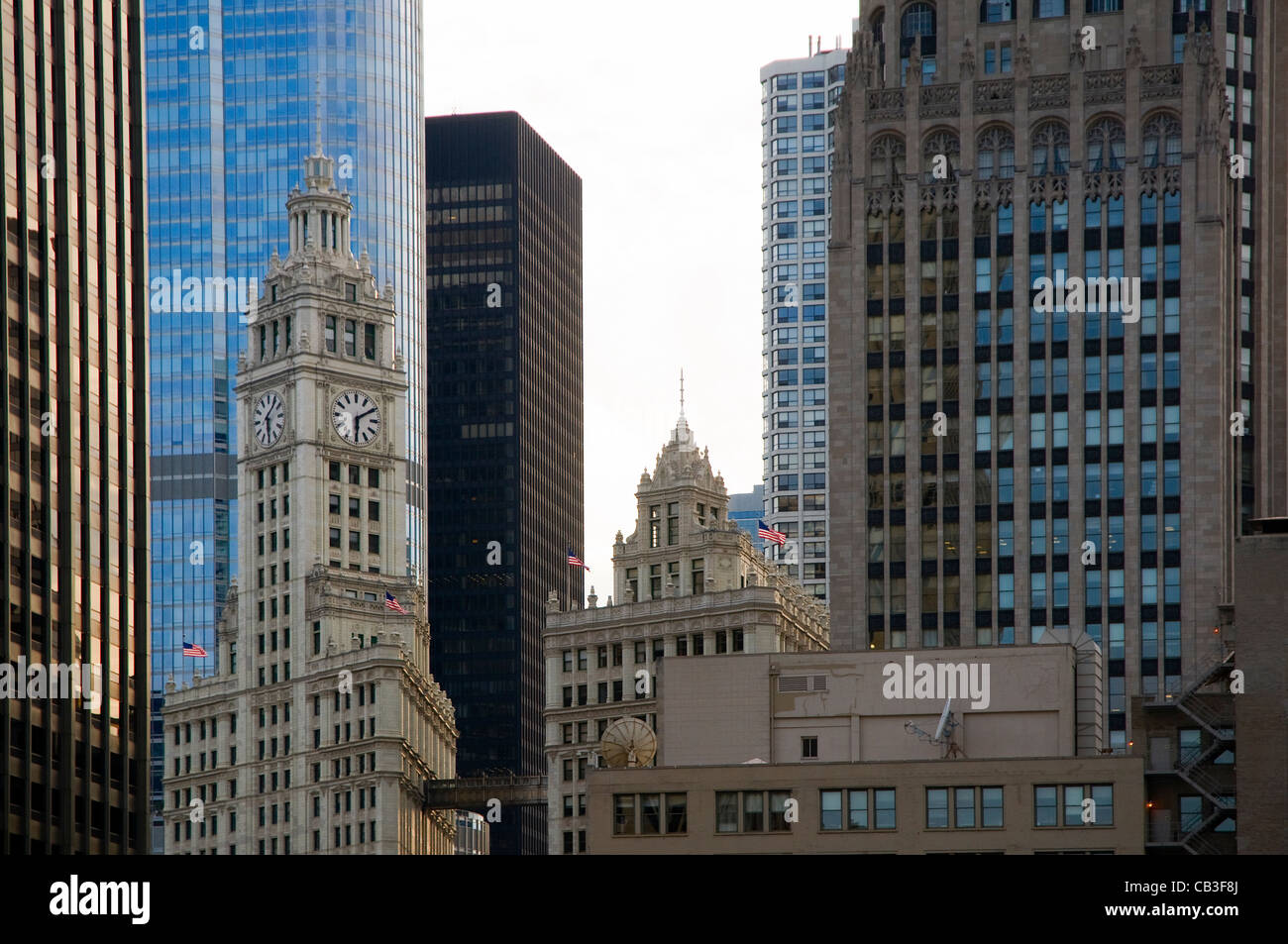 The Wrigley clock tower dominated by newer buildings in Chicago Stock ...