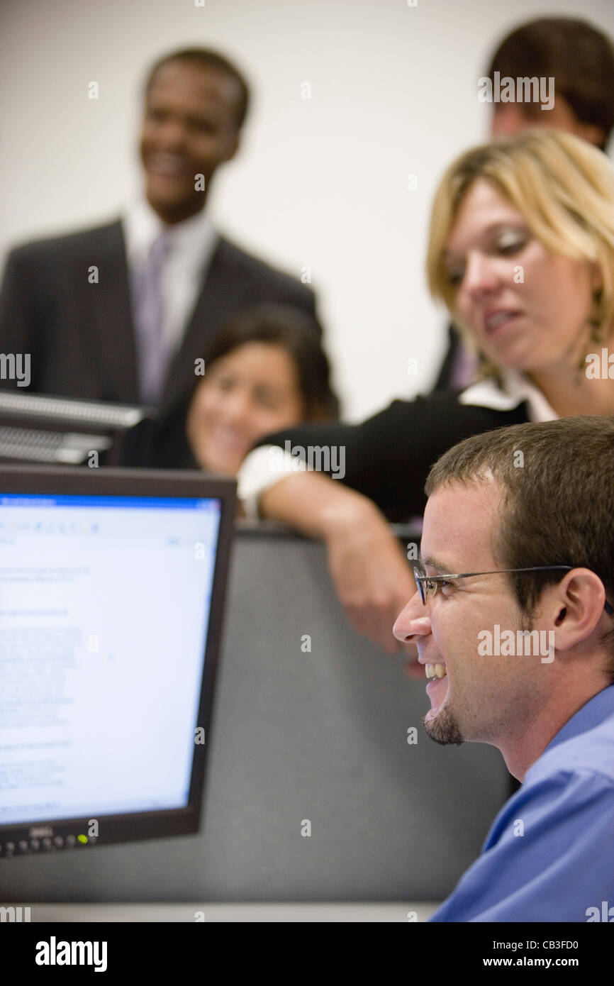 Office workers working on computer Stock Photo - Alamy