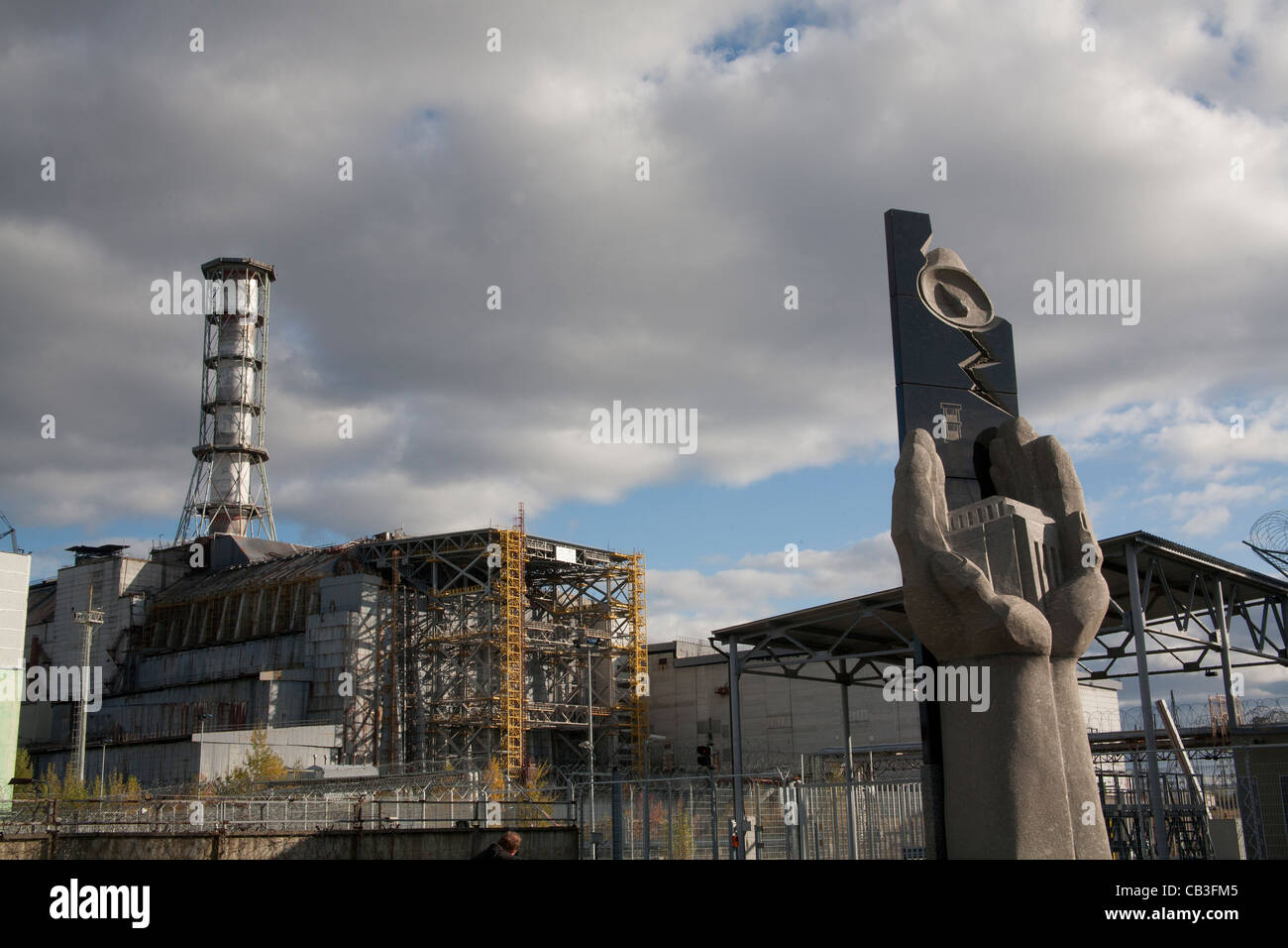 Memorial to the Chernobyl liquidators with Reactor number 4 in the ...