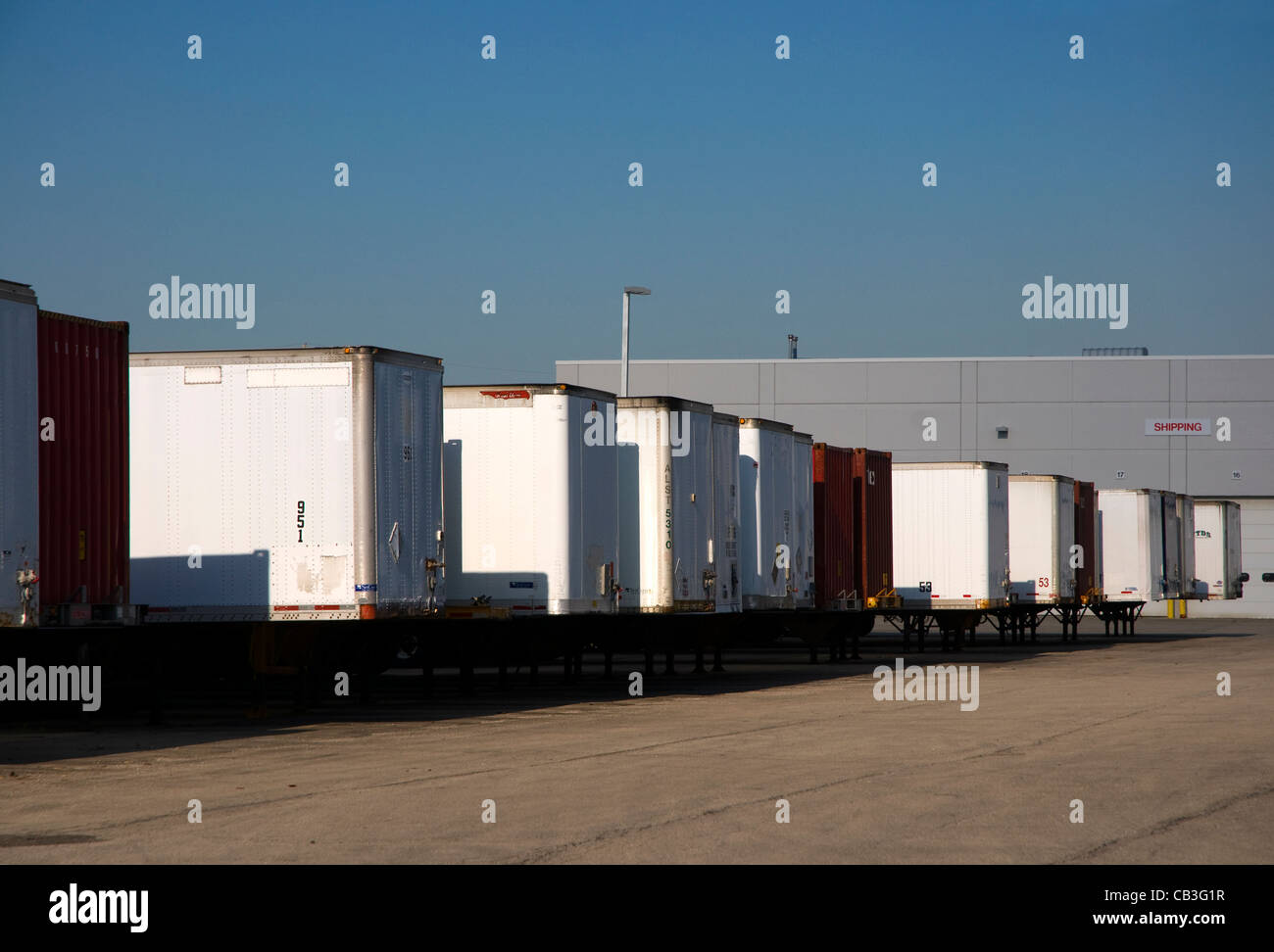 A line of trailers ready for transportation by truck in Chicago Stock ...