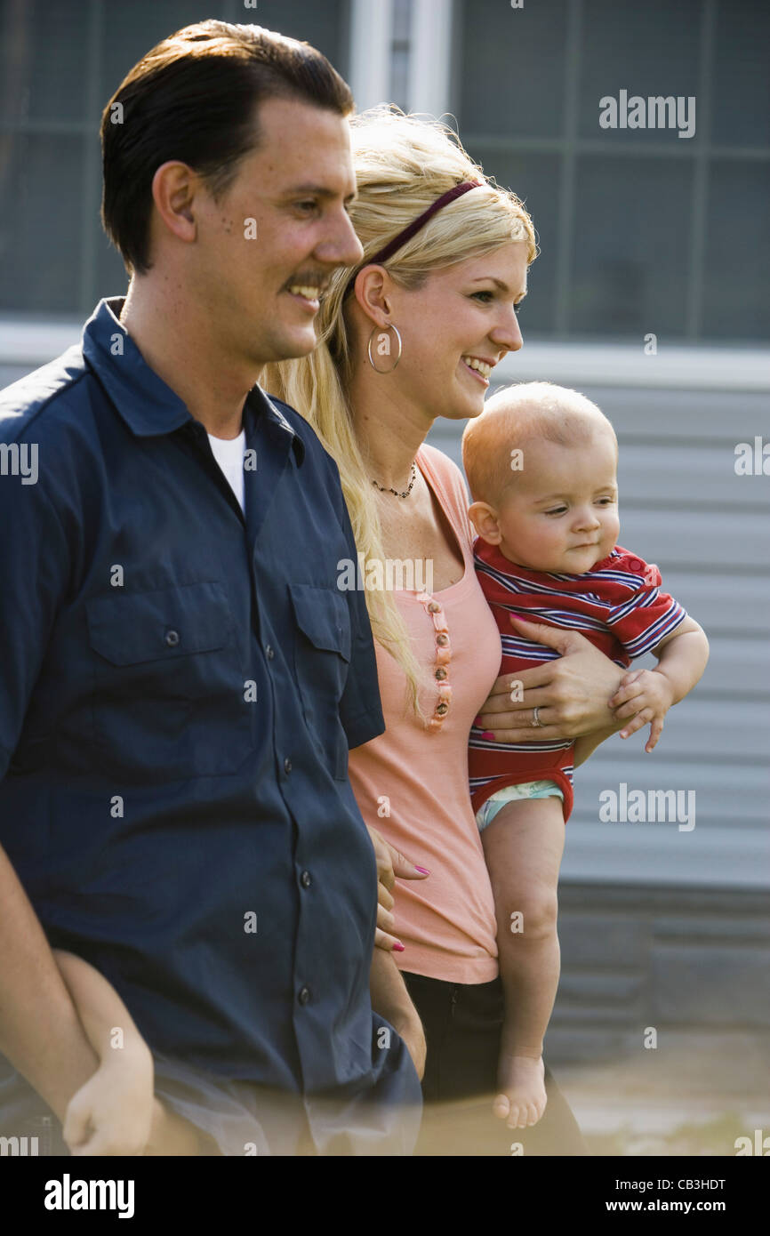 A family standing together Stock Photo - Alamy