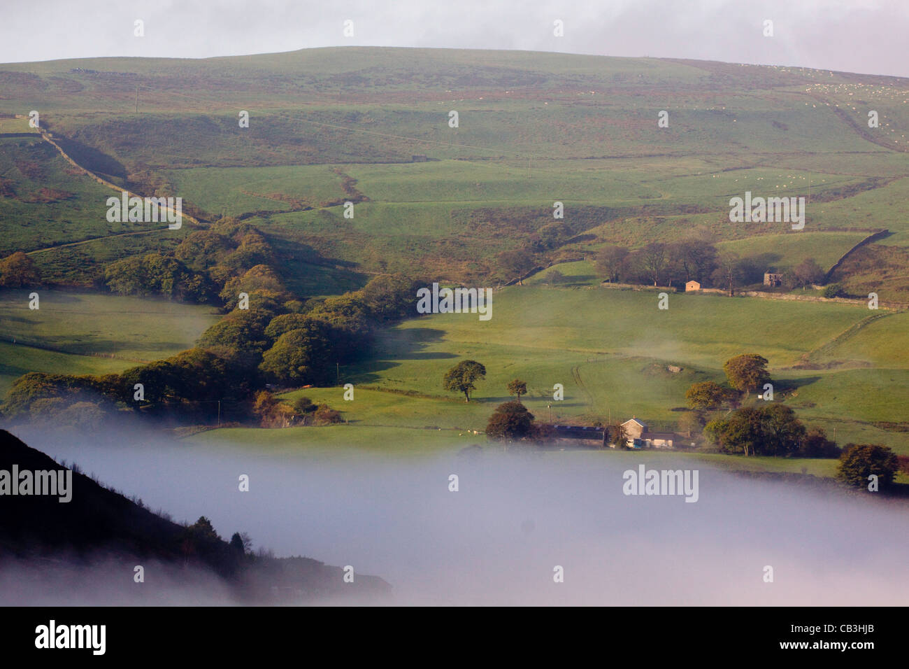 a view of mist in a valley Stock Photo - Alamy