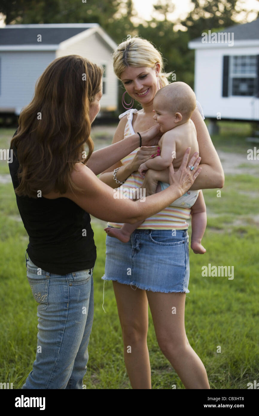 Two women with baby Stock Photo - Alamy