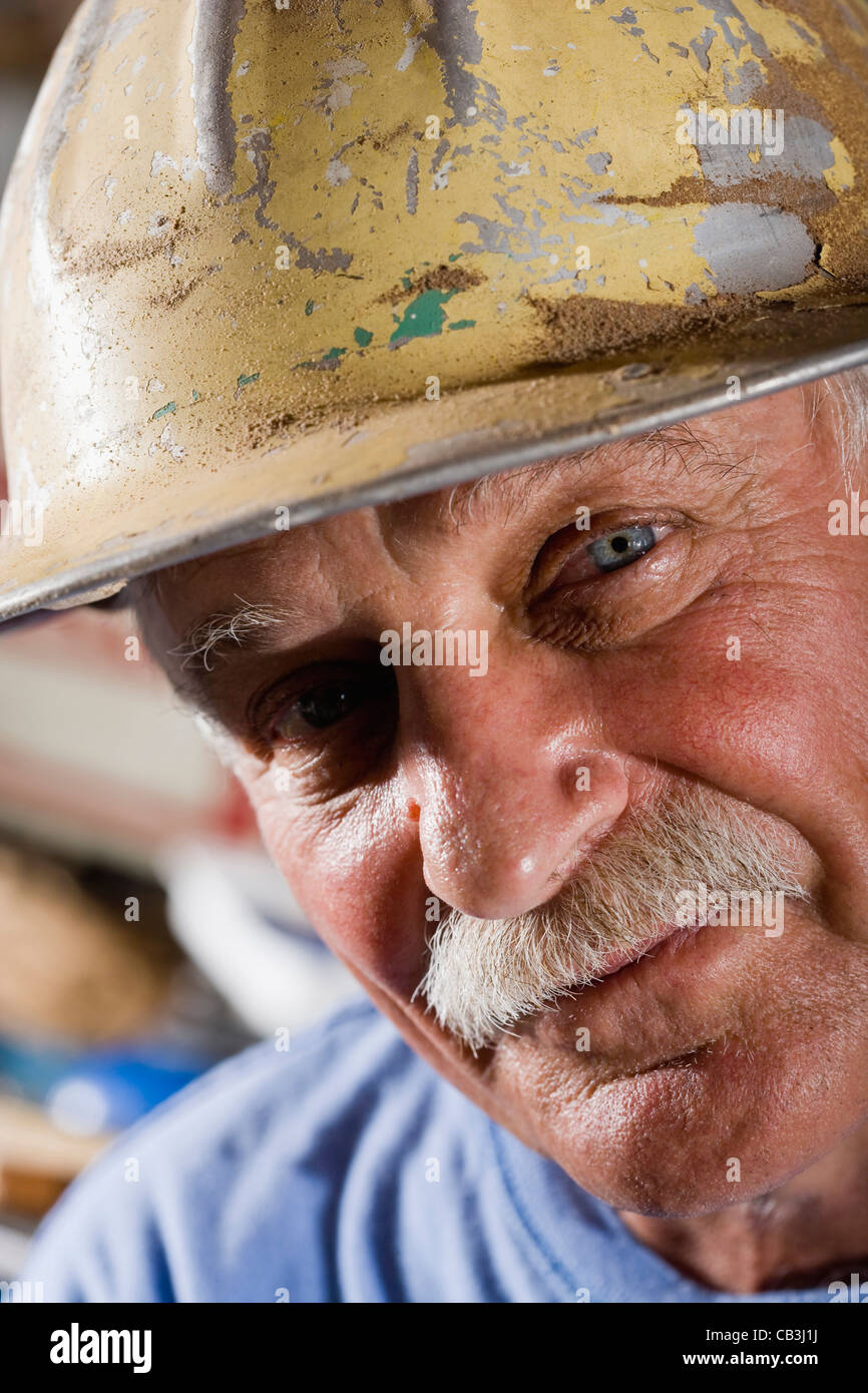Senior man wearing hard hat hi-res stock photography and images - Alamy