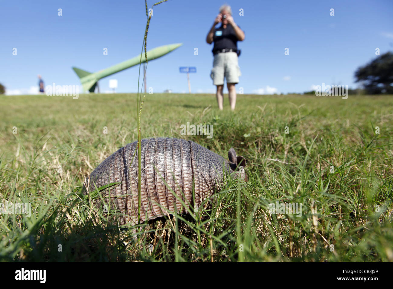 A Kennedy Space Center visitor photographs an Armadillo with a rocket ...