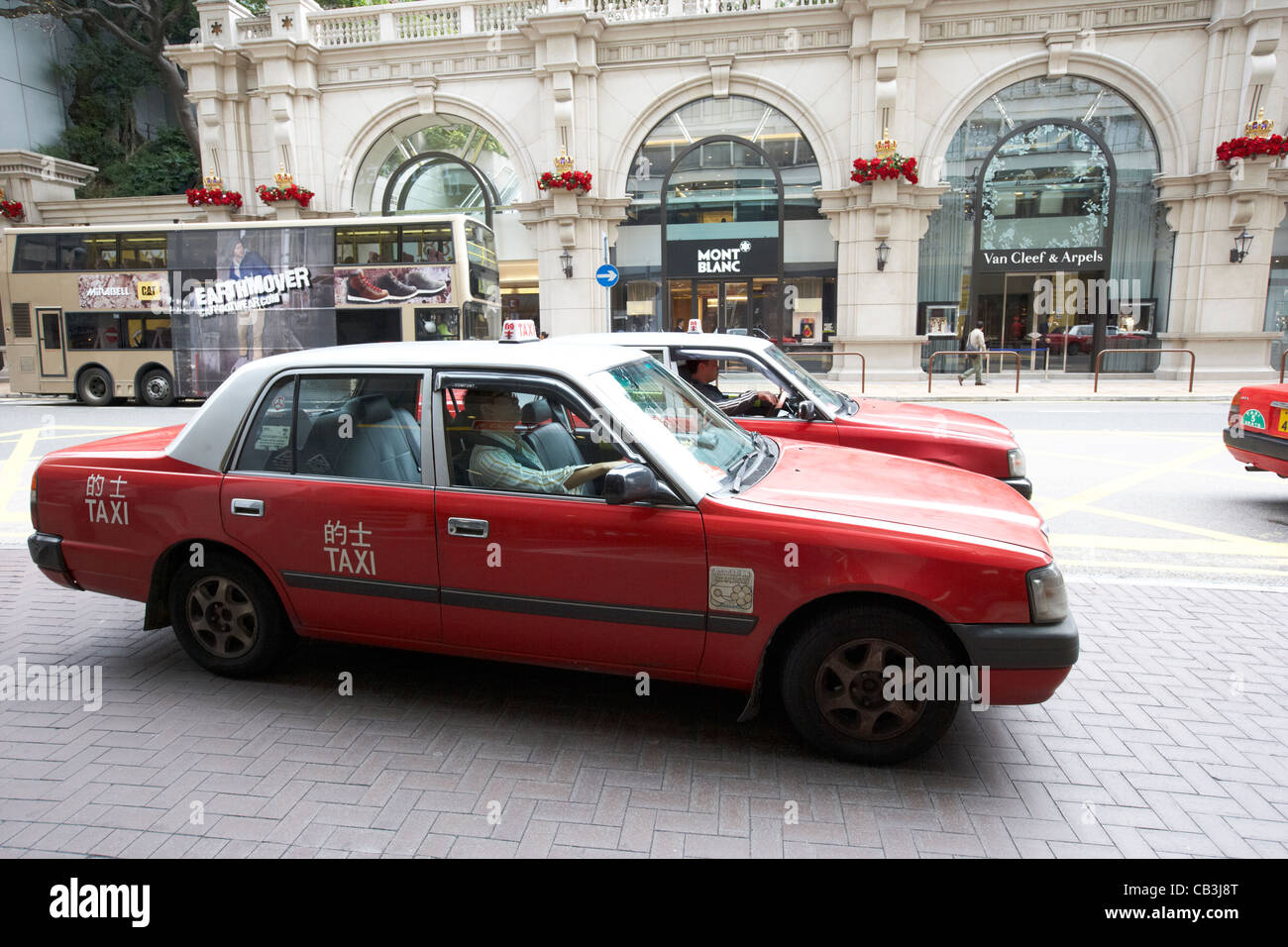 hong kong red taxi kowloon hong kong hksar china Stock Photo - Alamy